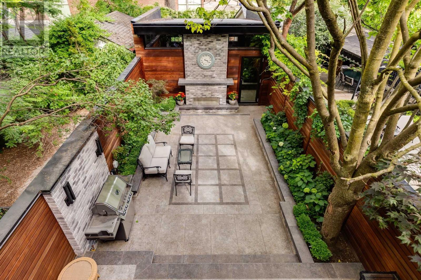 Garage wall to fire place conversion. Yorkville - MVK Landscape Design